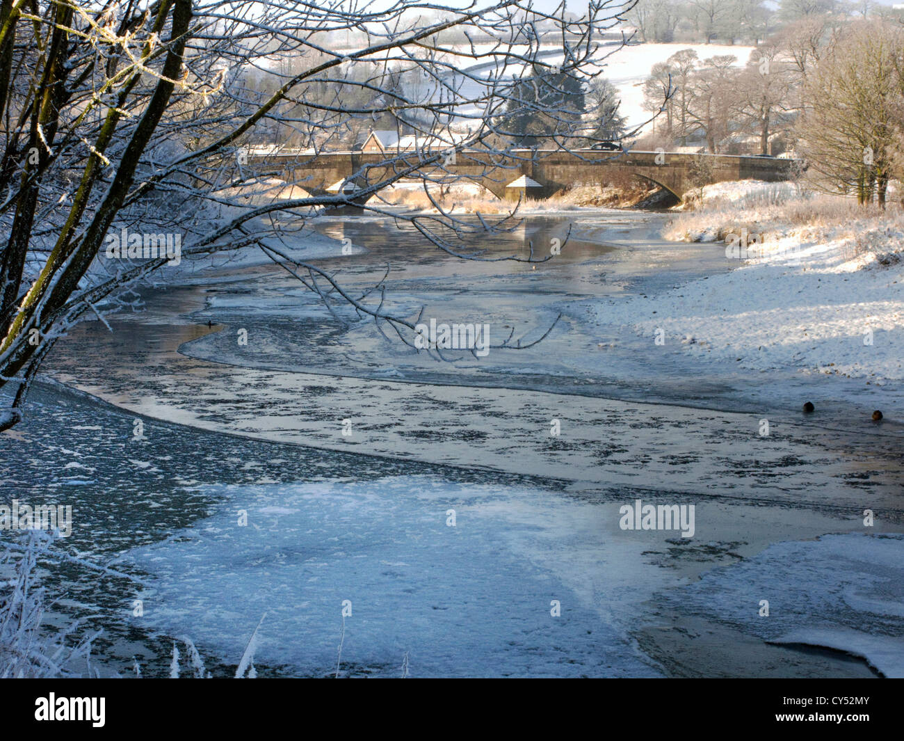 Frozen River Ribble at Sawley Bridge with thick ice at Sawley ...