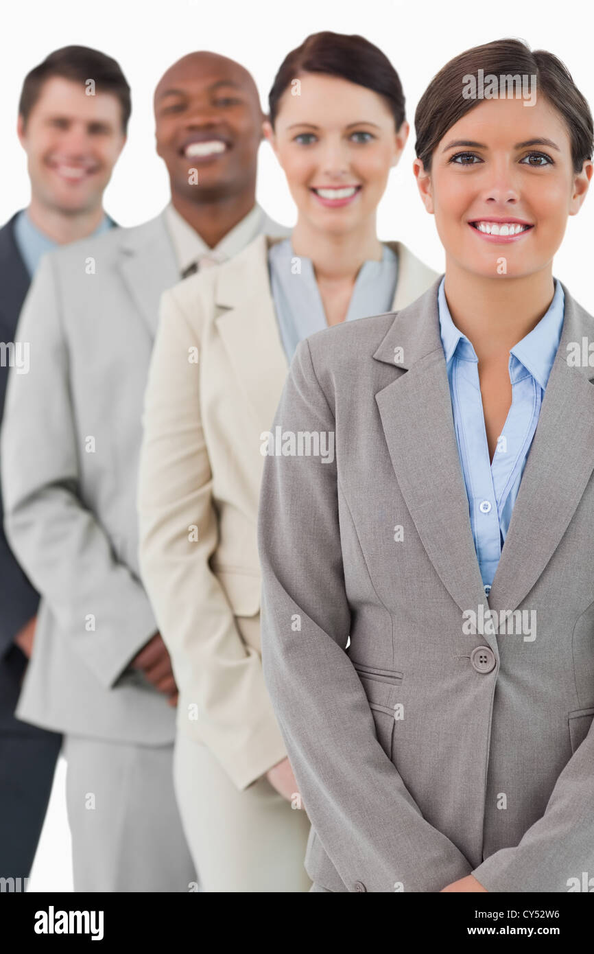 Cheerful smiling business team standing together Stock Photo - Alamy