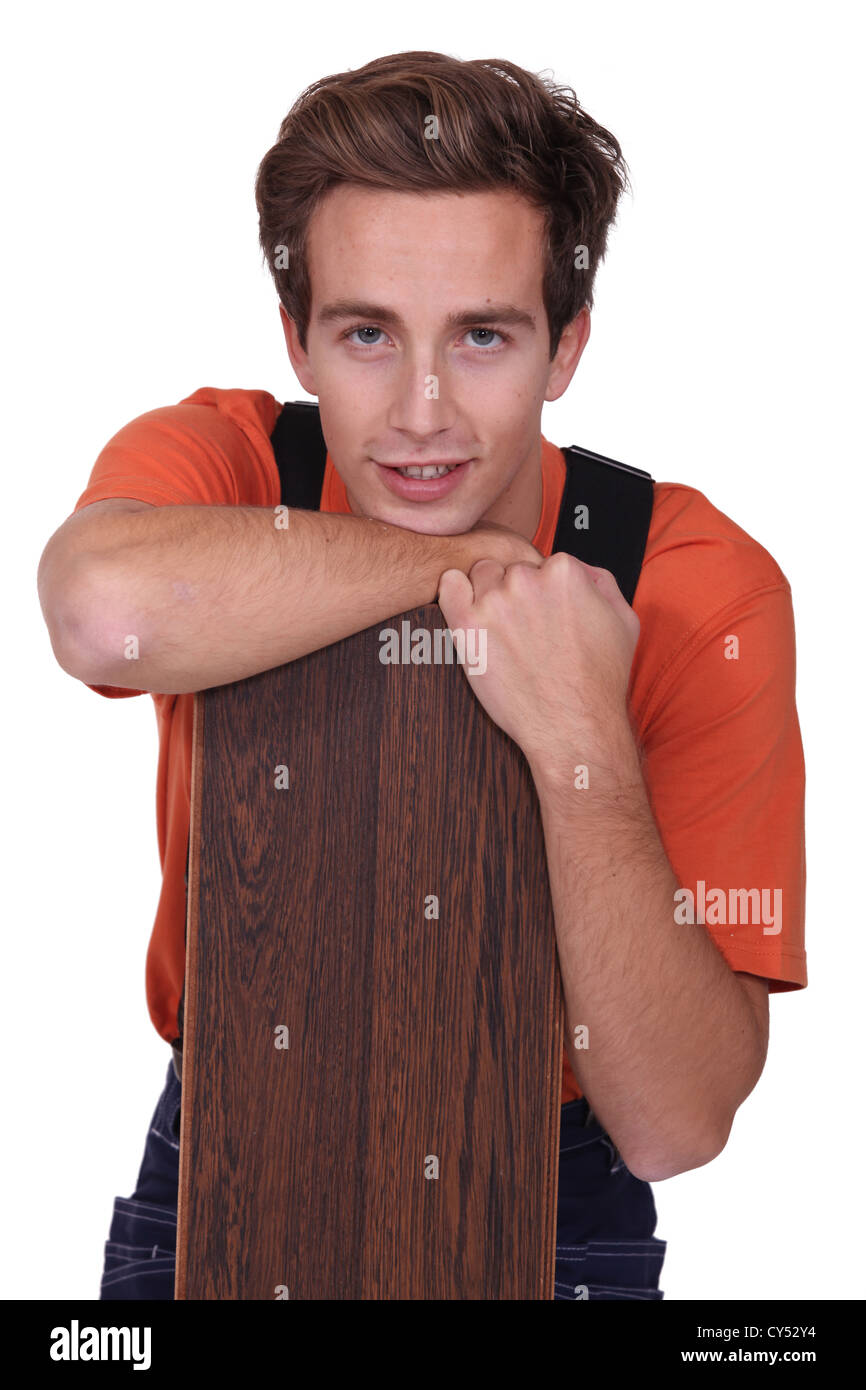 Young man with wooden floor boards Stock Photo - Alamy