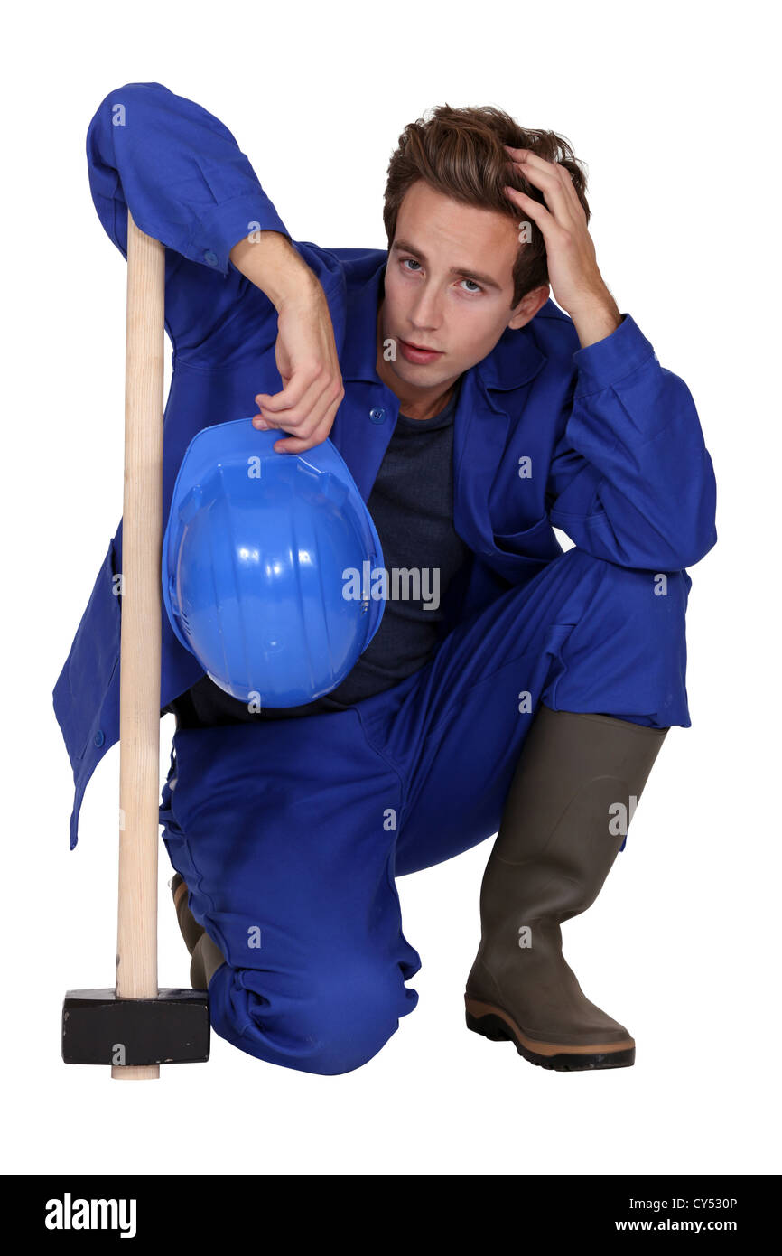 Tired construction worker Stock Photo - Alamy