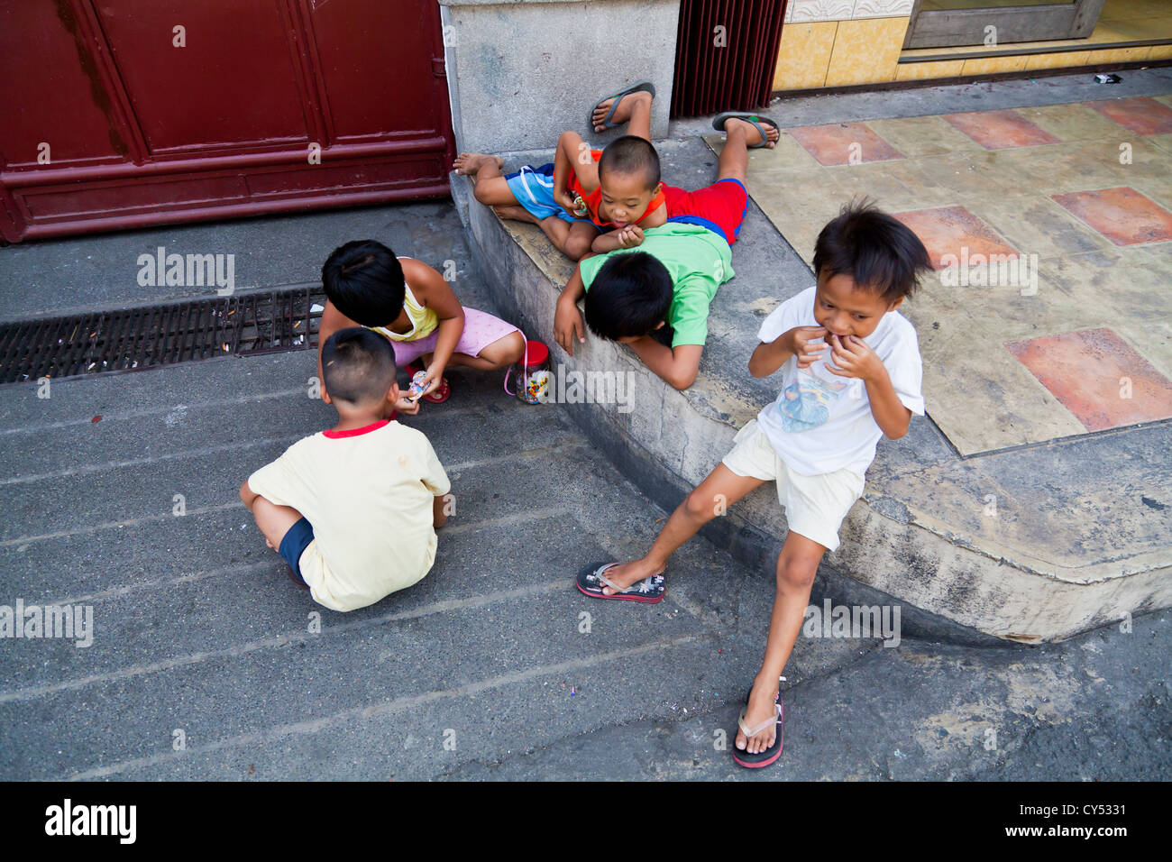 Street children in manila play hi-res stock photography and images - Alamy