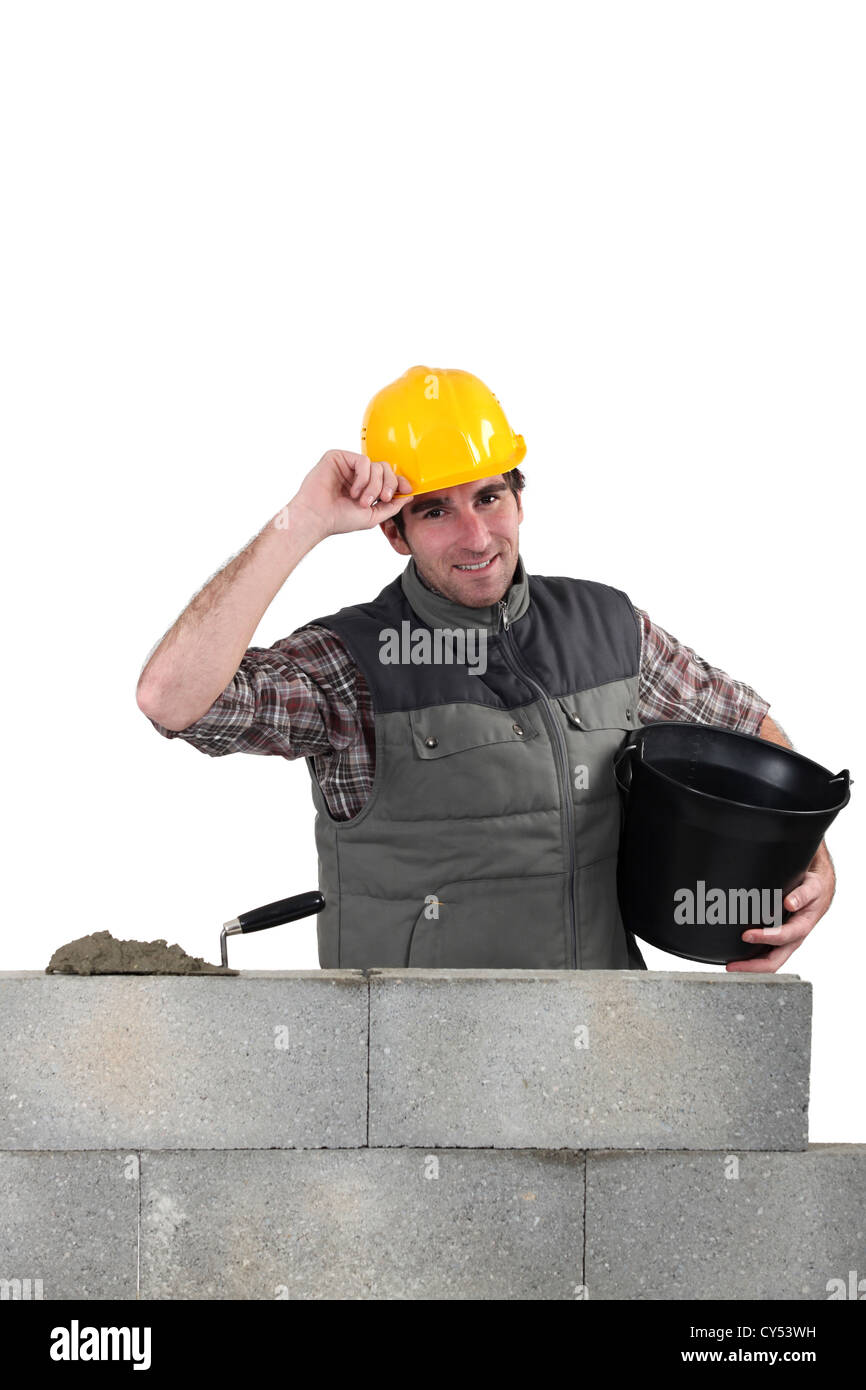 Man laying a blocks wall Stock Photo - Alamy