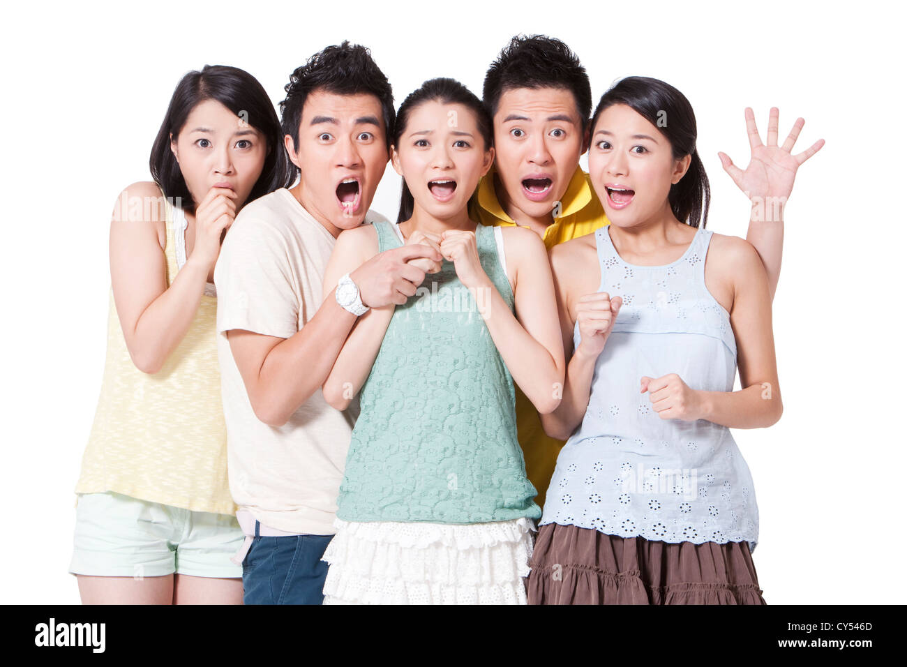 Terrified young people huddling together Stock Photo - Alamy