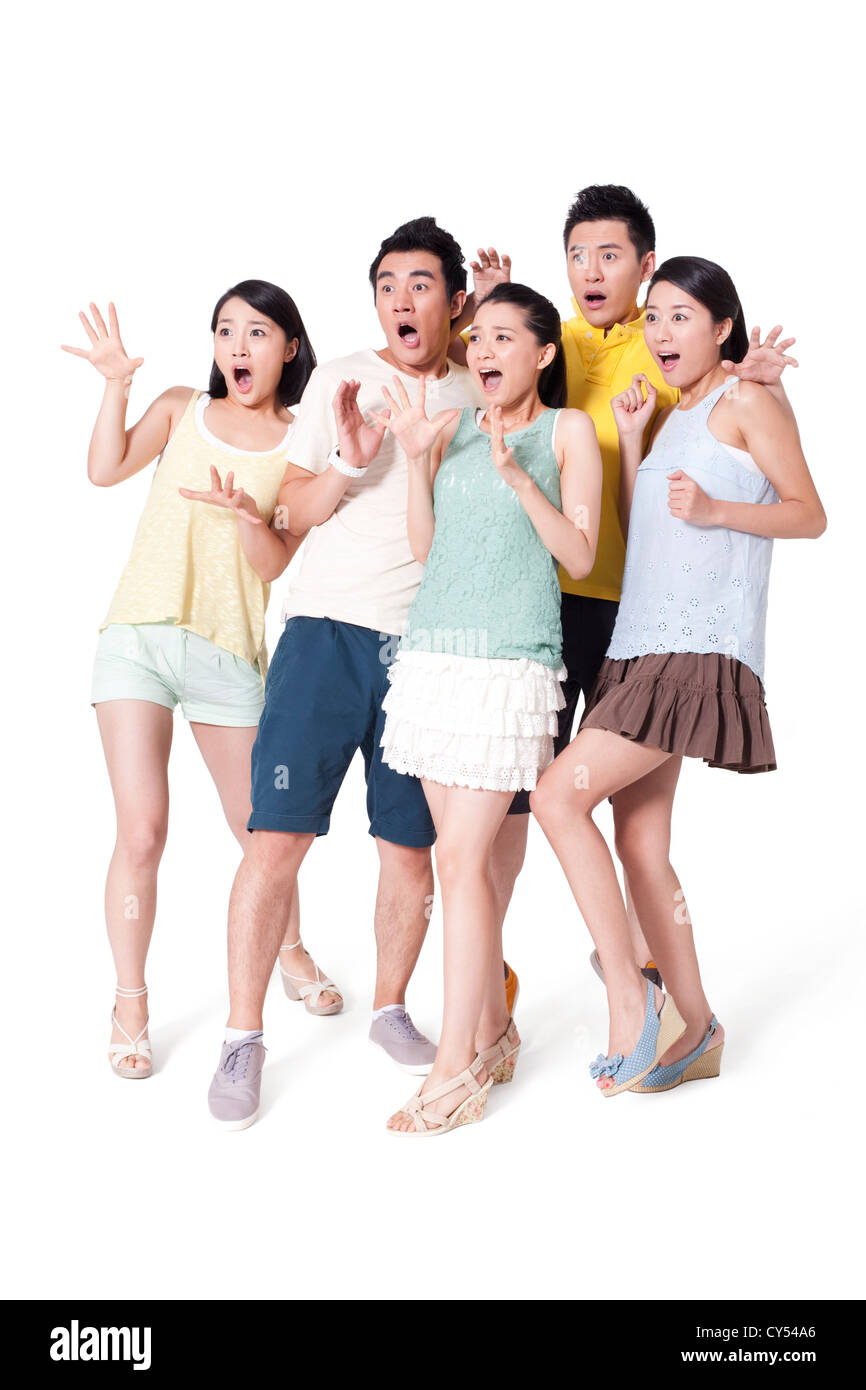 Surprised young people leaning back Stock Photo - Alamy