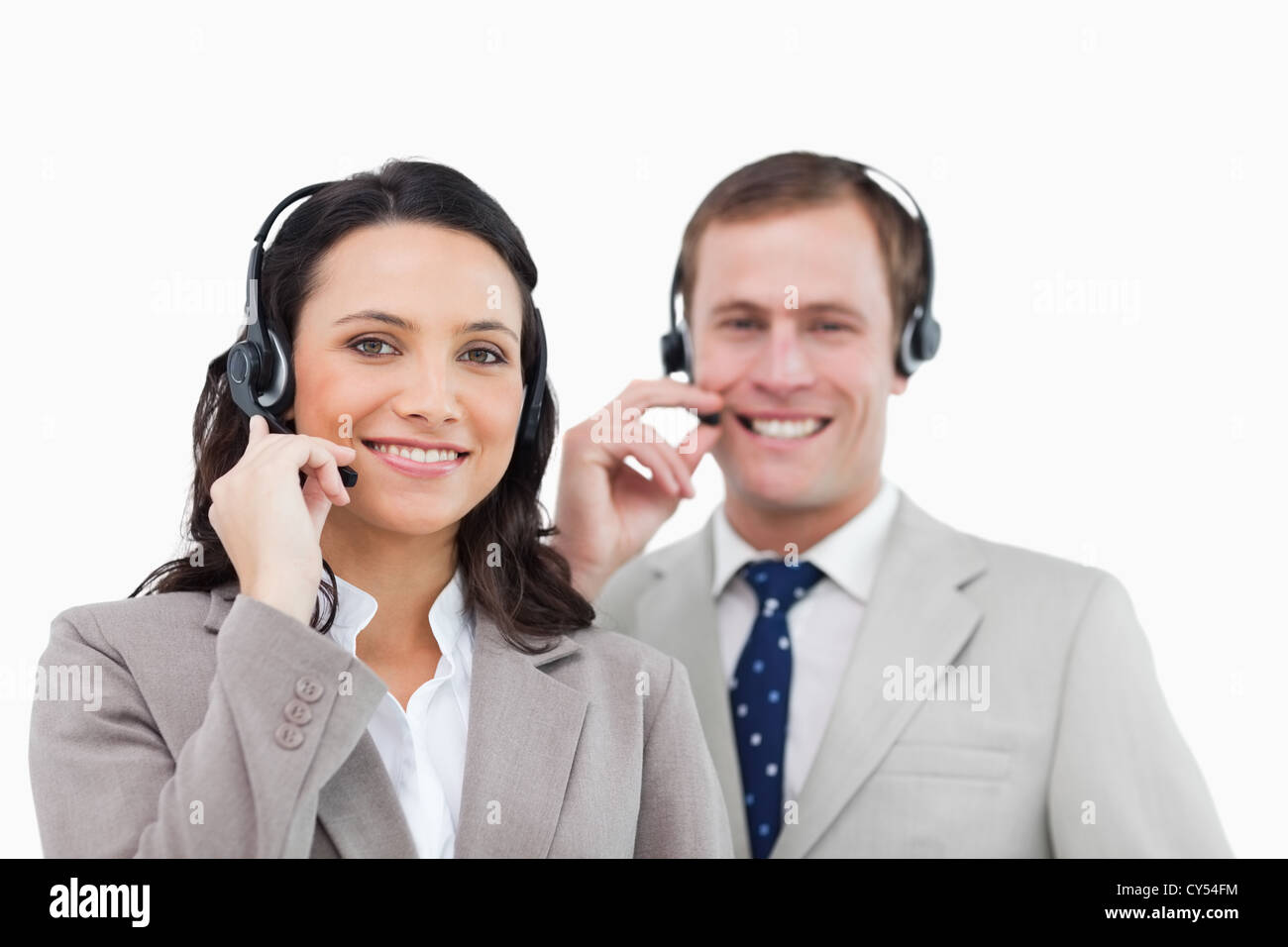 Smiling call center team with their headsets Stock Photo - Alamy