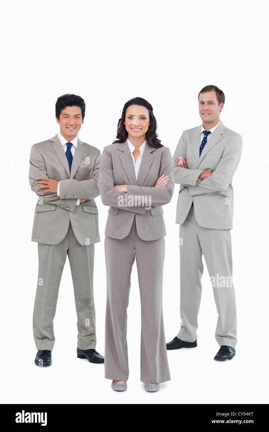 Smiling young business people with arms folded Stock Photo - Alamy