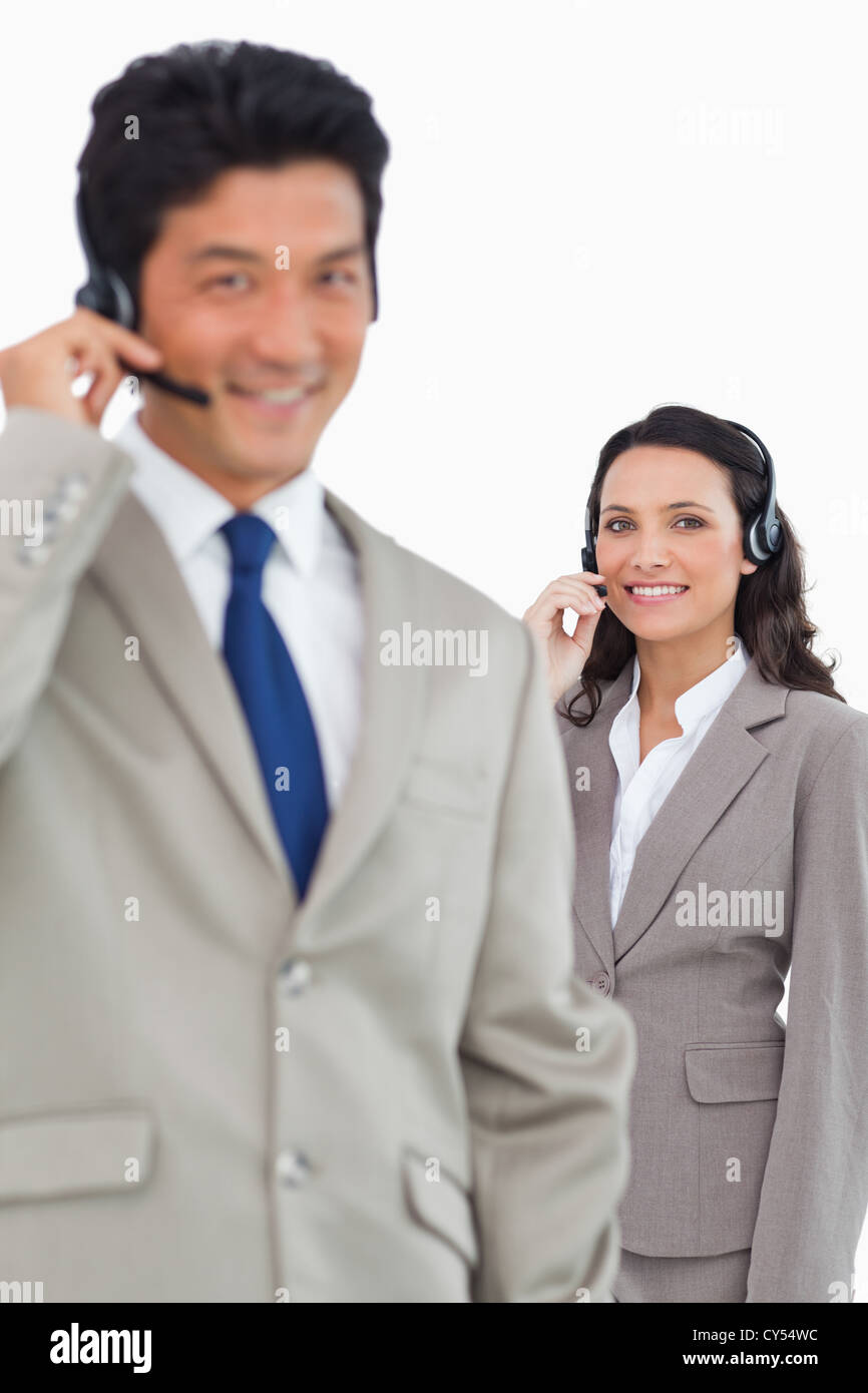 Smiling customer support employees Stock Photo - Alamy