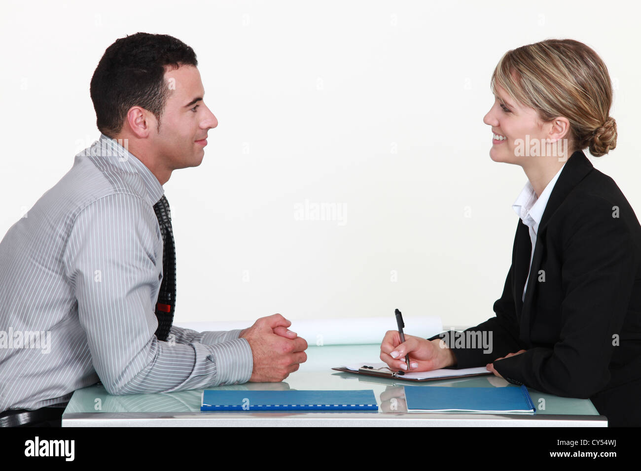 A man and a woman during an interview Stock Photo - Alamy