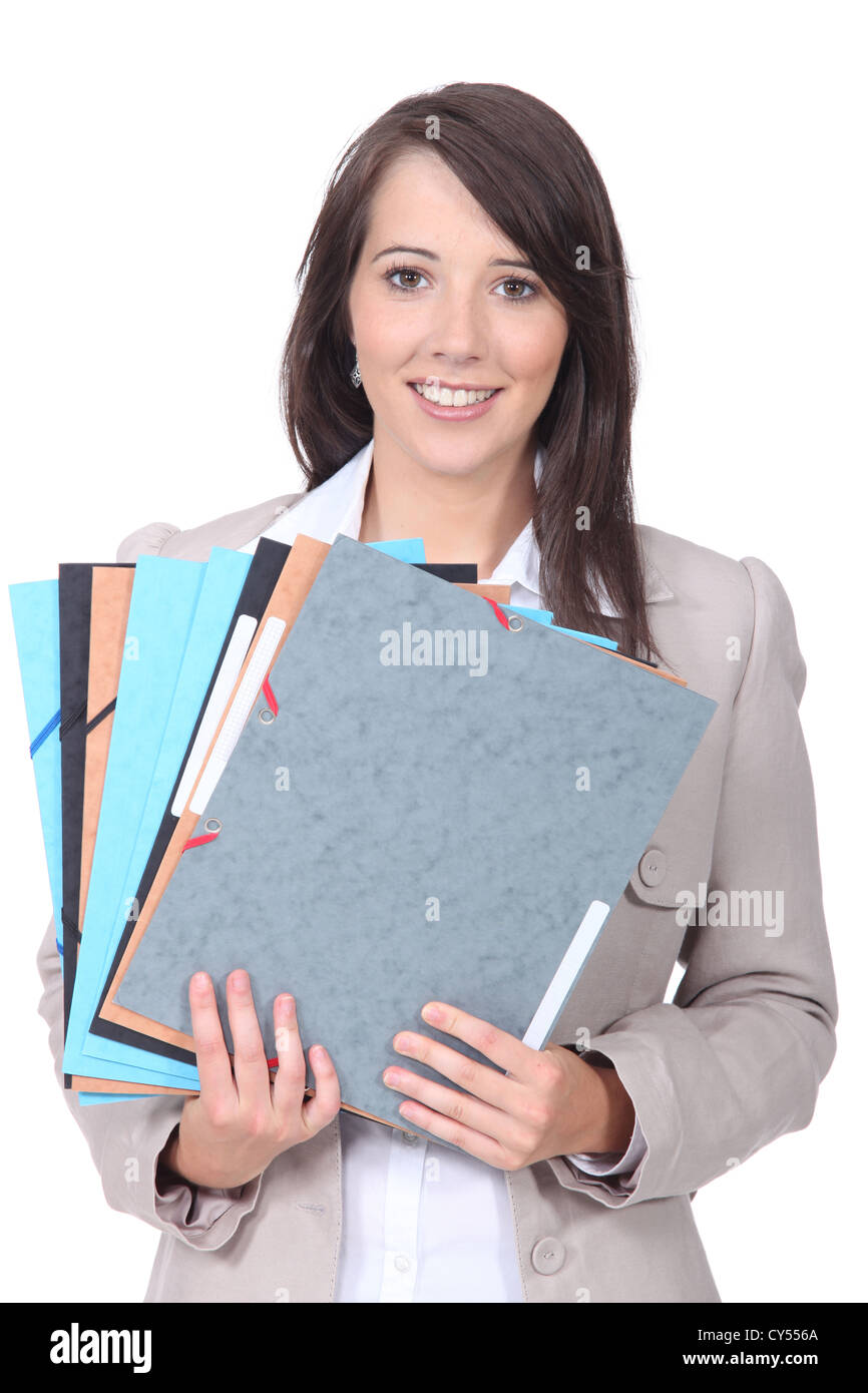 Female office worker with a pile of paperwork Stock Photo - Alamy