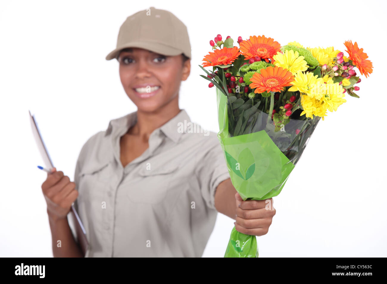 Delivery woman giving flowers Stock Photo - Alamy
