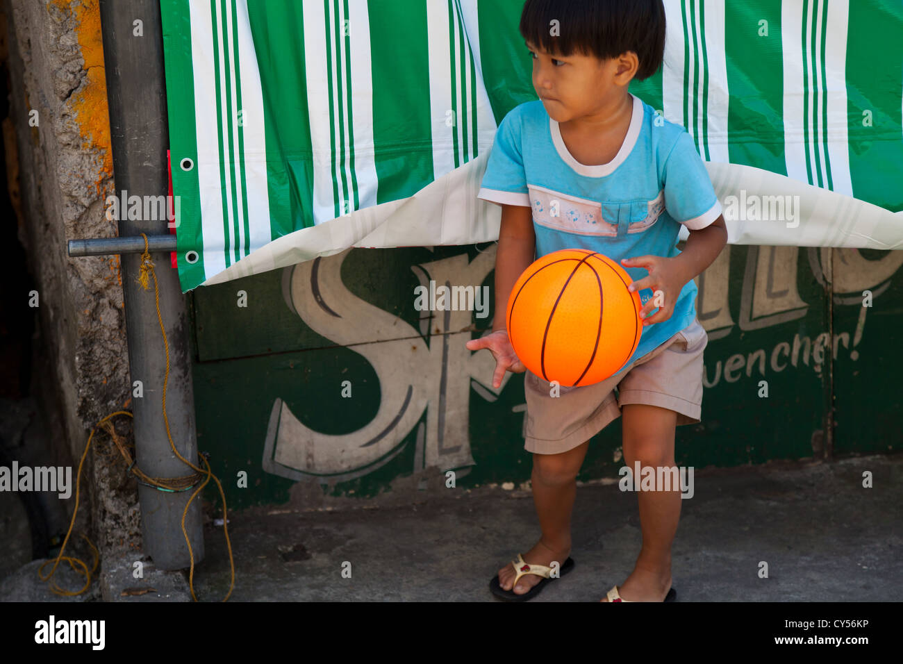 Little Boy with a Ball in the Old Town of Manila, Philippines Stock ...