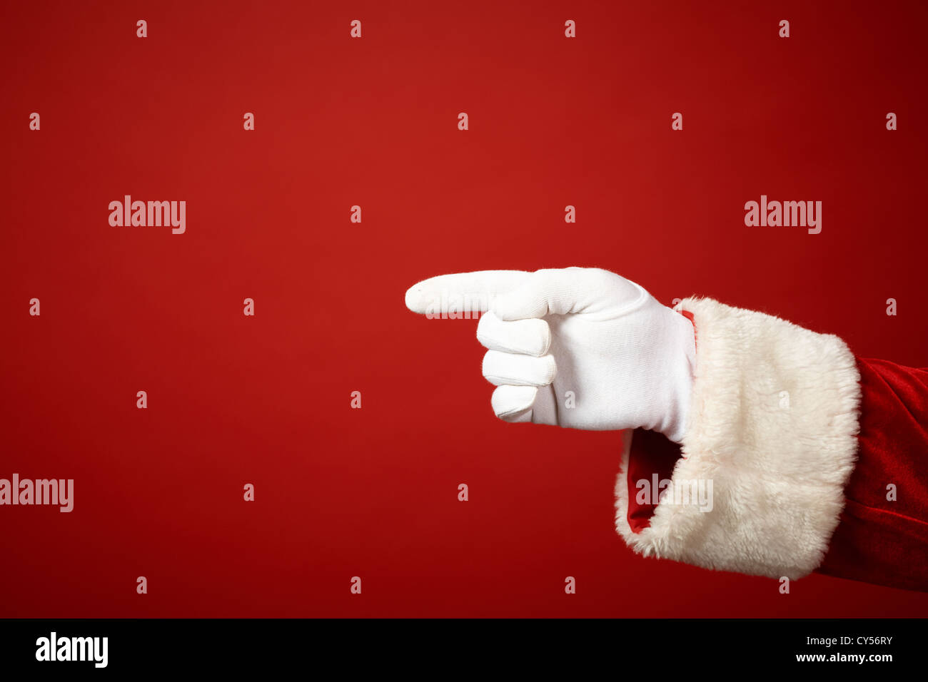 Photo of Santa Claus gloved hand in pointing gesture Stock Photo - Alamy