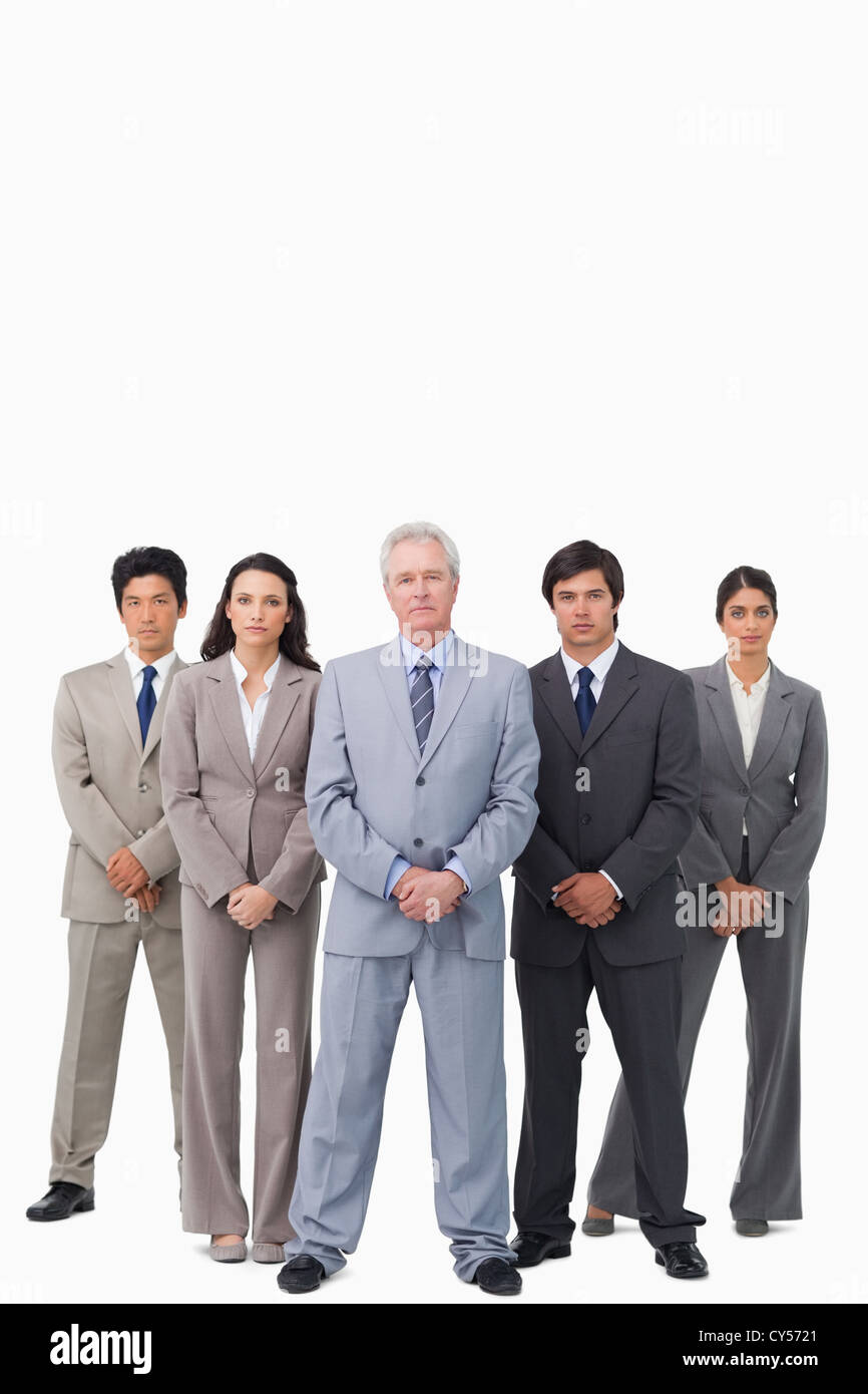 Mature salesman standing together with his team Stock Photo - Alamy