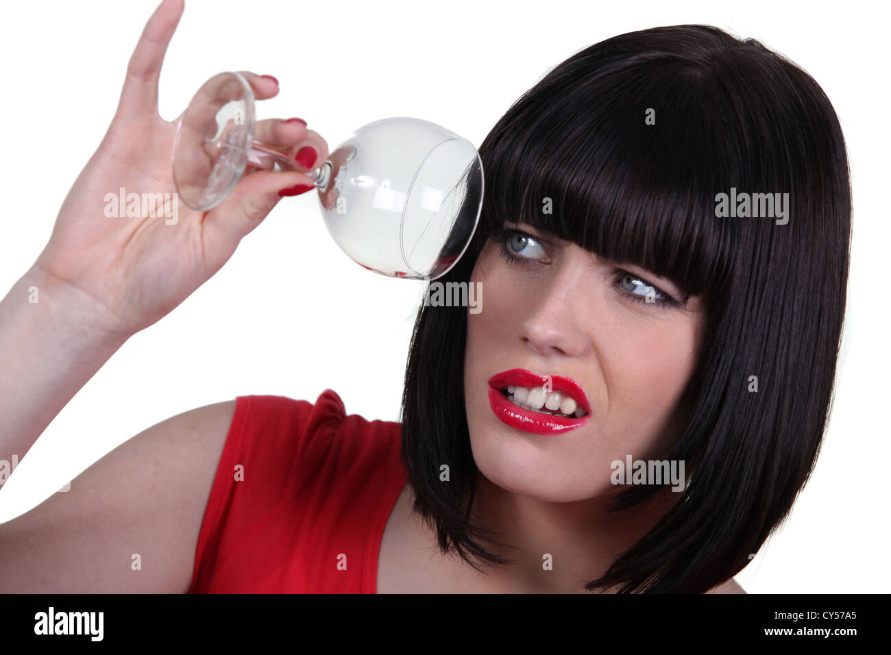 Woman checking empty wine glass Stock Photo - Alamy Woman checking empty wine glass Stock Photo - Alamy