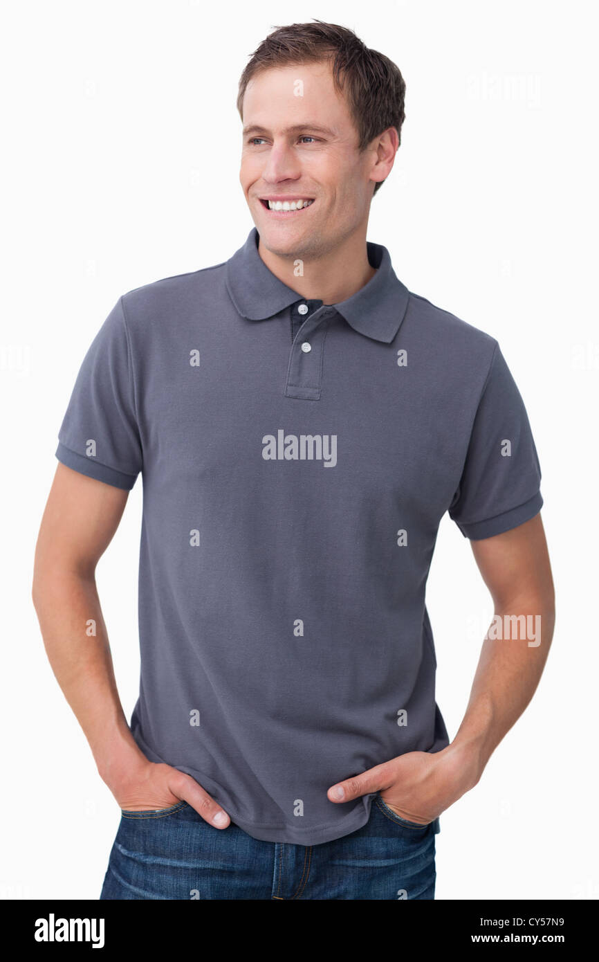 Smiling male with hands in his pockets Stock Photo - Alamy