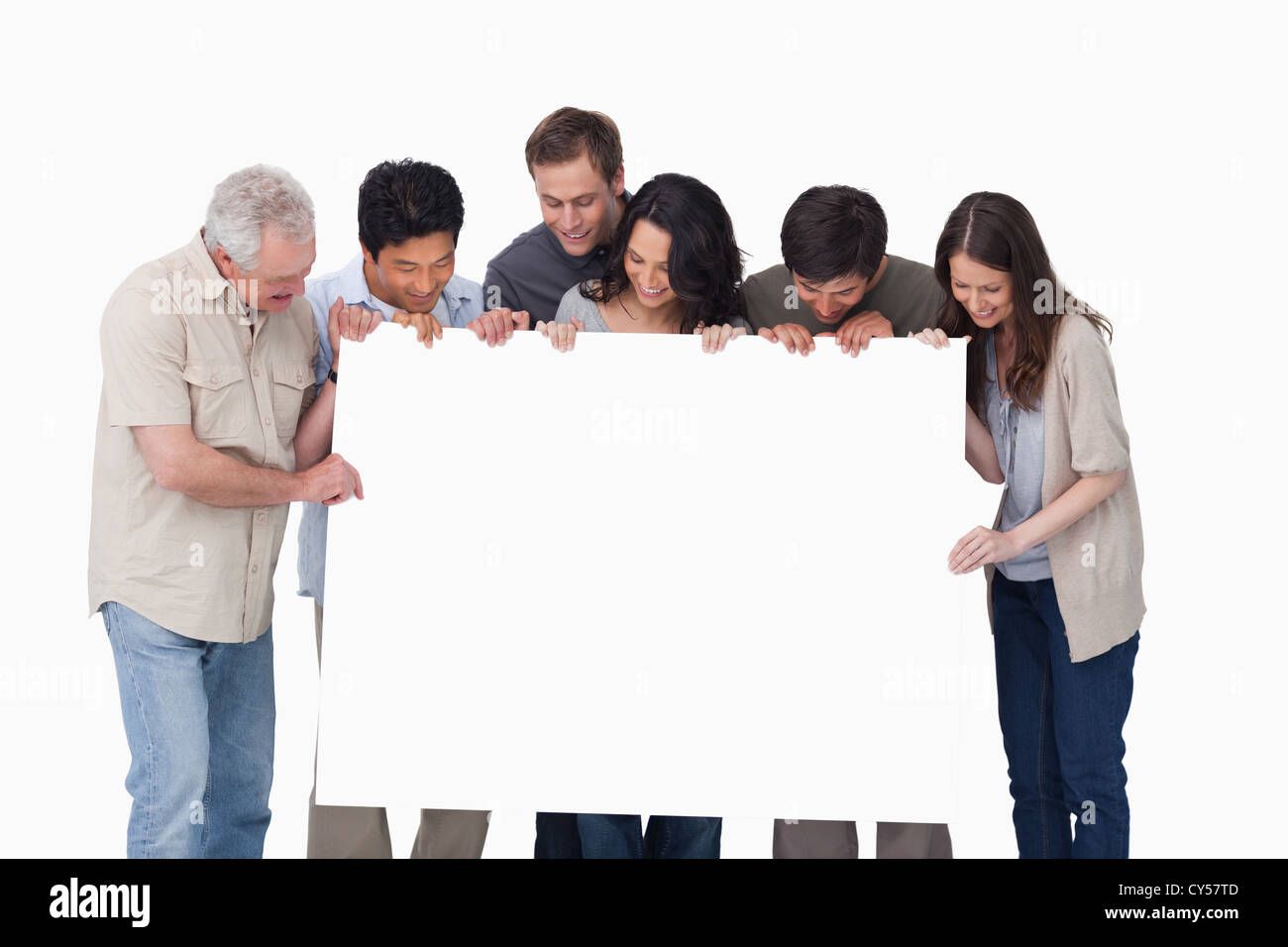Group looking at blank sign in their hand Stock Photo - Alamy