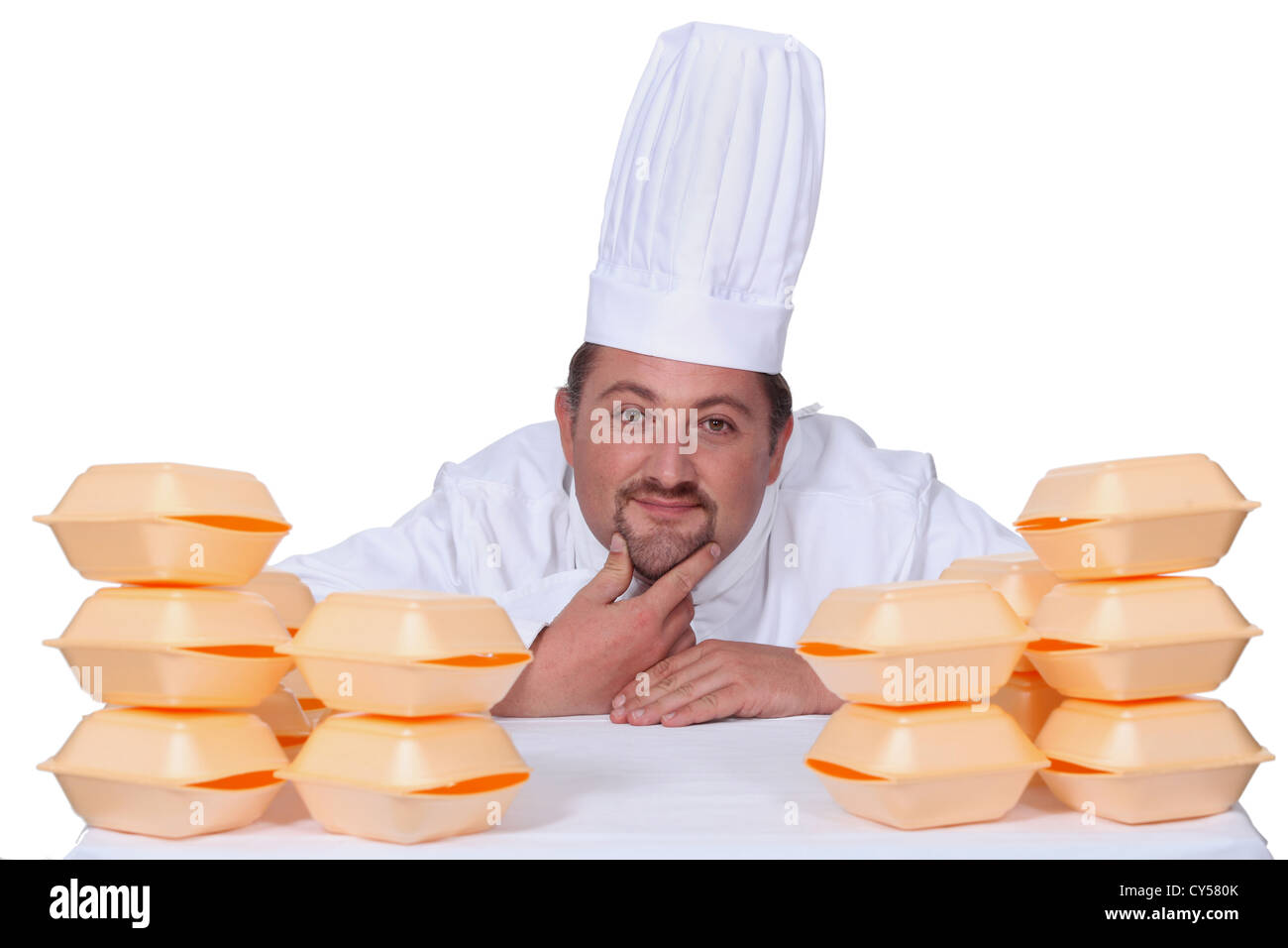Chef stood in front of fast food packaging Stock Photo - Alamy