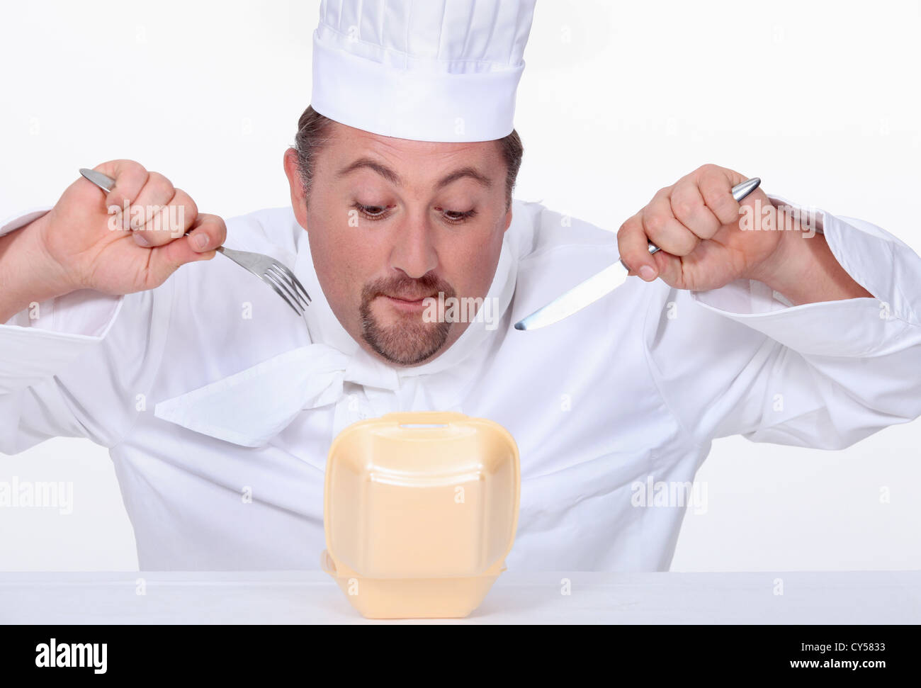 Chef eating junk food Stock Photo - Alamy