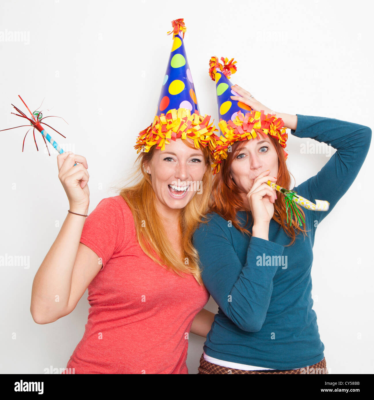 Young women wearing party hats hi-res stock photography and images - Alamy