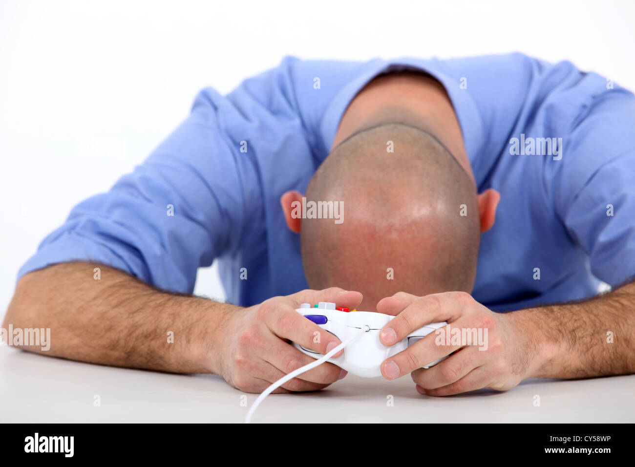 Stressed man playing video game Stock Photo - Alamy