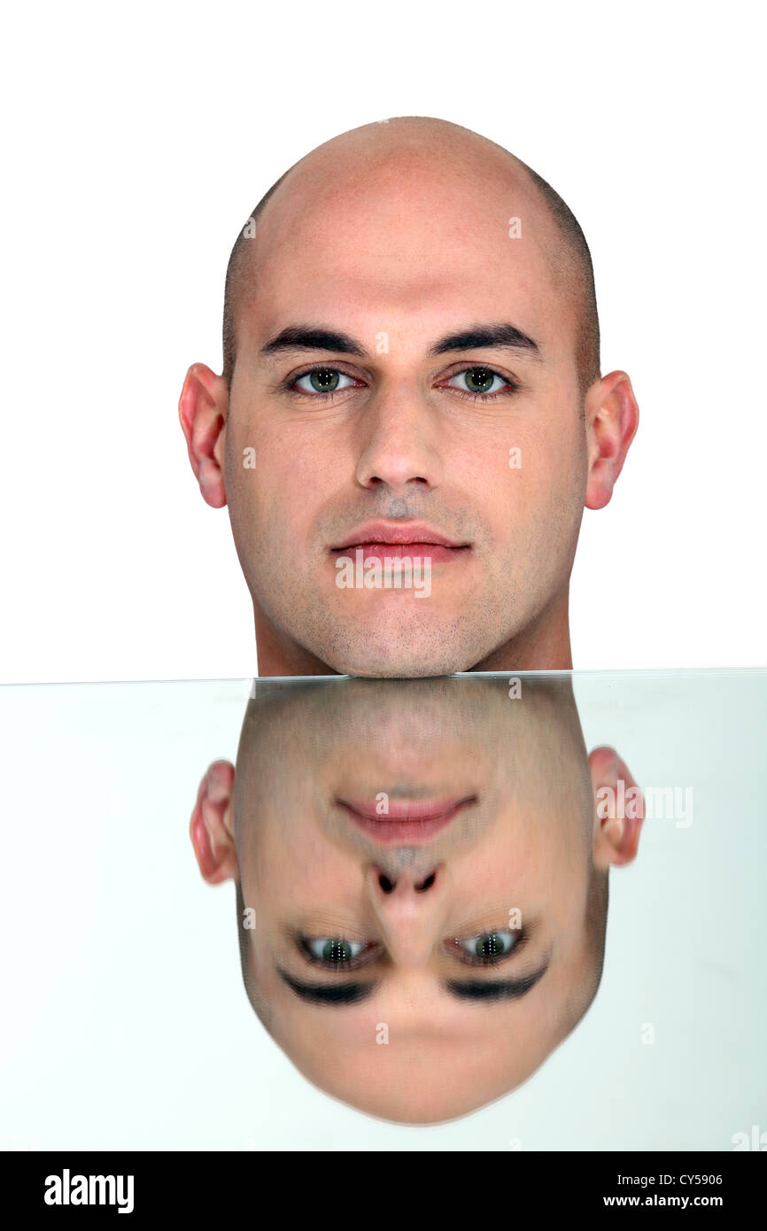 Reflection of bald man Stock Photo - Alamy