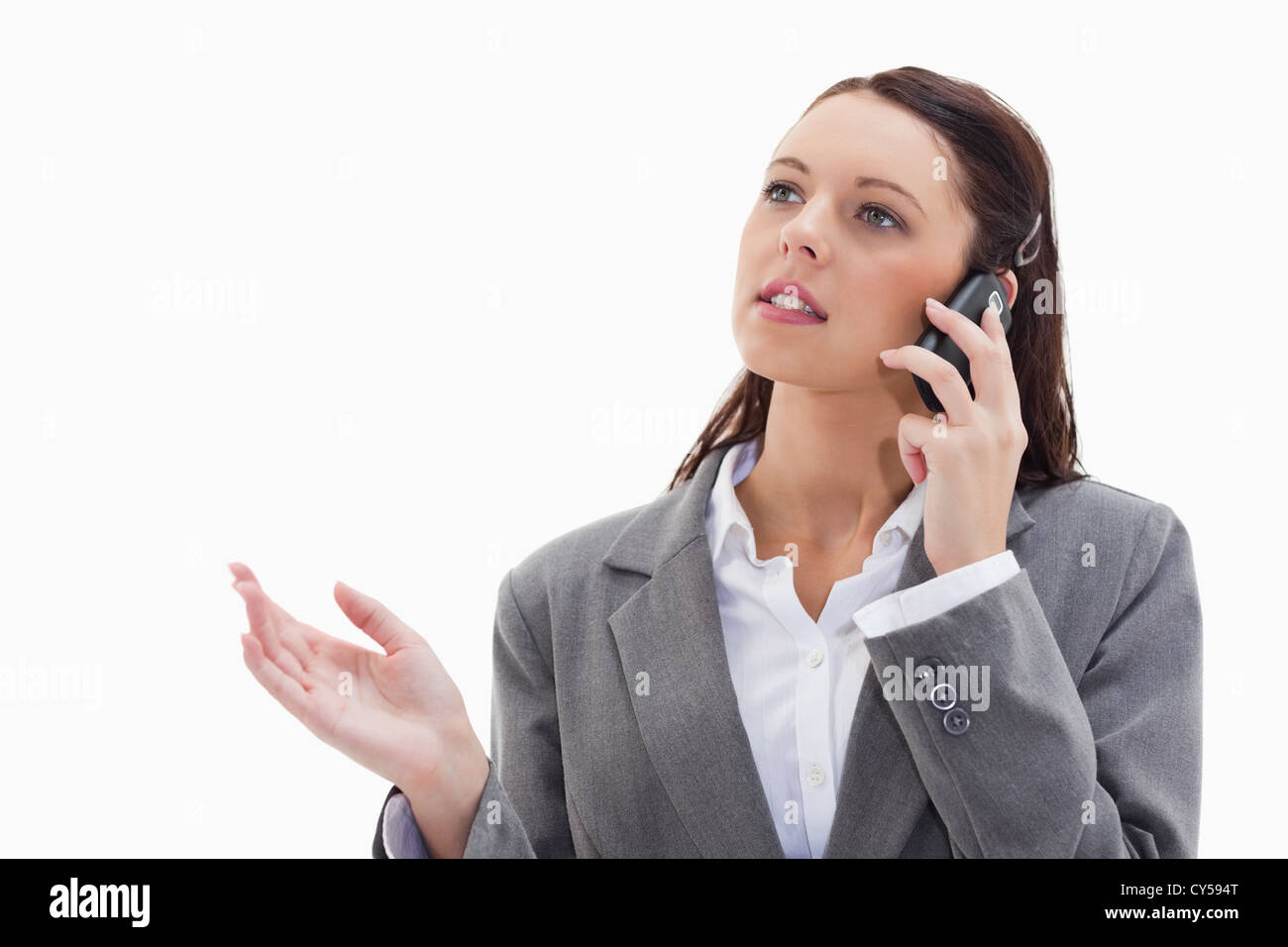 Businesswoman on the phone explaining Stock Photo - Alamy