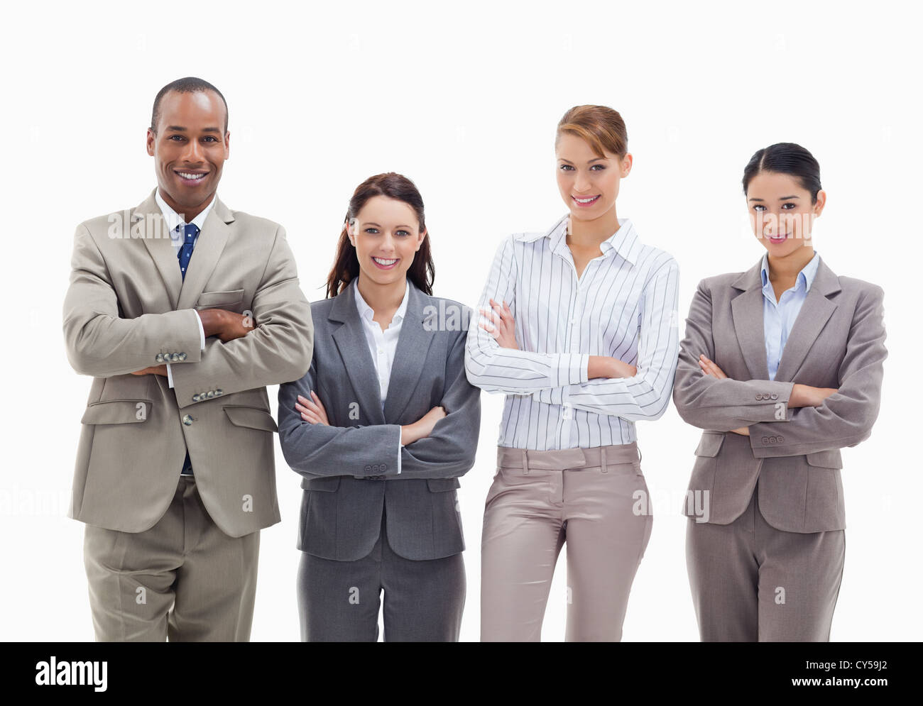 Close-up of a business team smiling side by side and crossing their ...