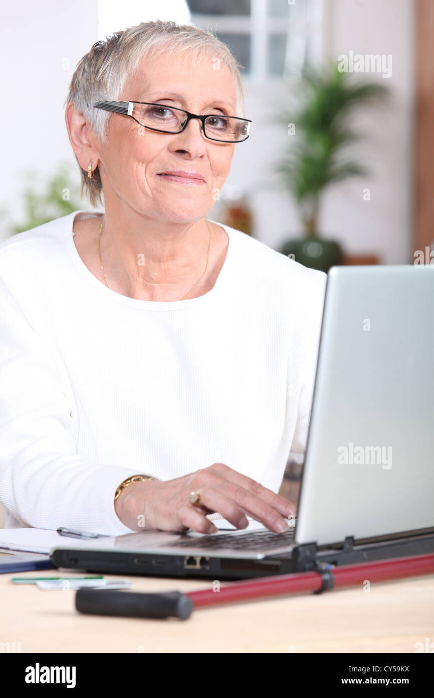 Elderly woman on laptop Stock Photo - Alamy