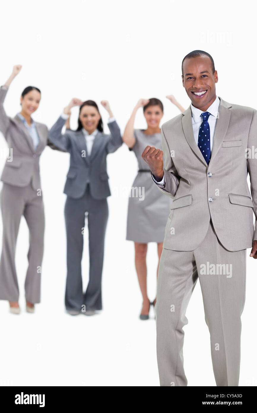 Successful business team with a happy businessman in foreground Stock ...