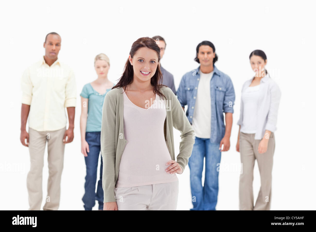 People standing behind a smiling woman Stock Photo - Alamy