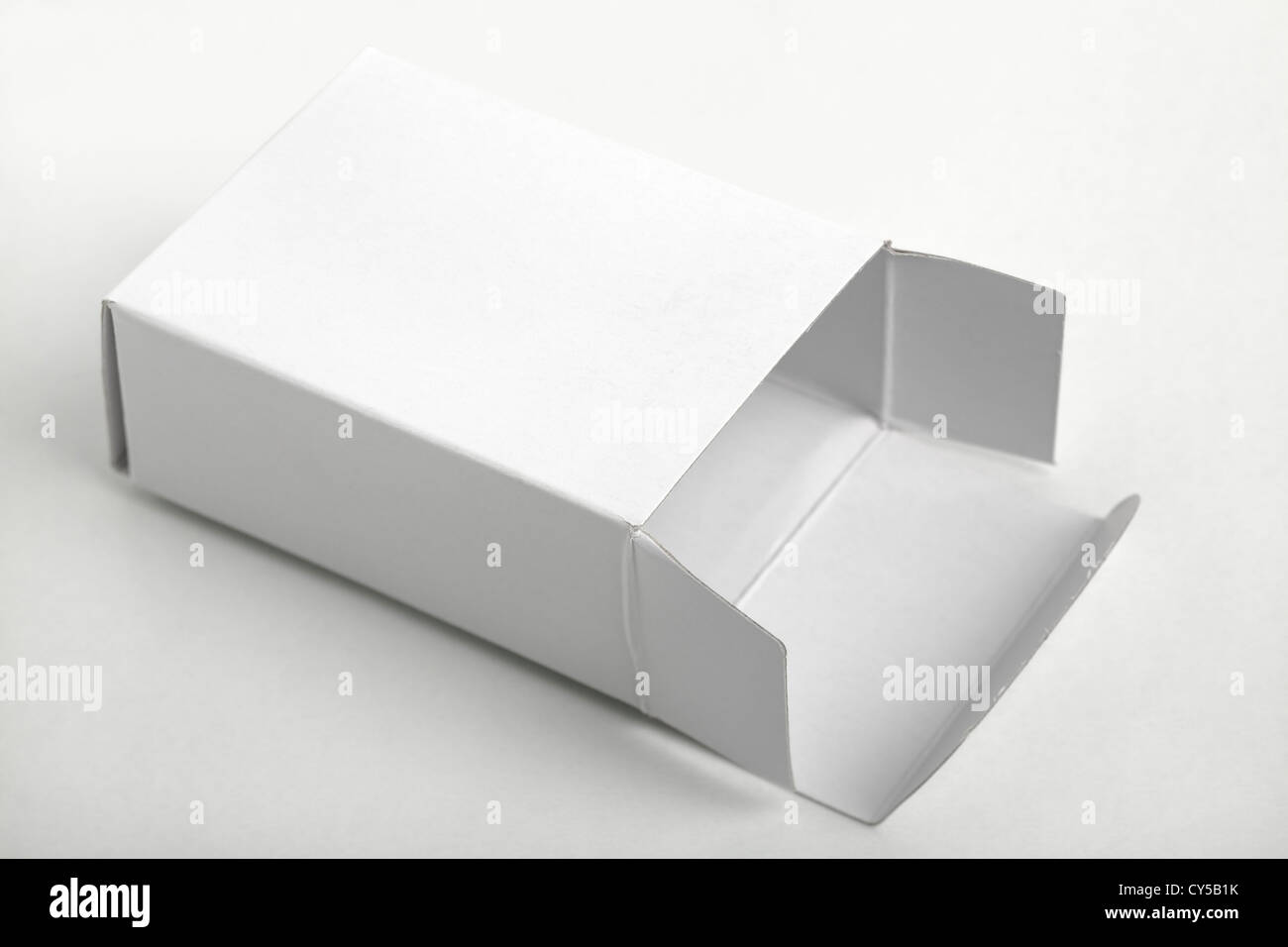 Close up of a small white cardboard box , isolated on white background ...