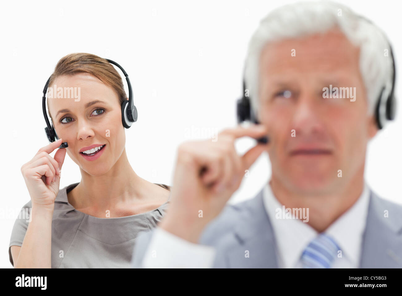 Woman in background man in front wearing a headset Stock Photo - Alamy