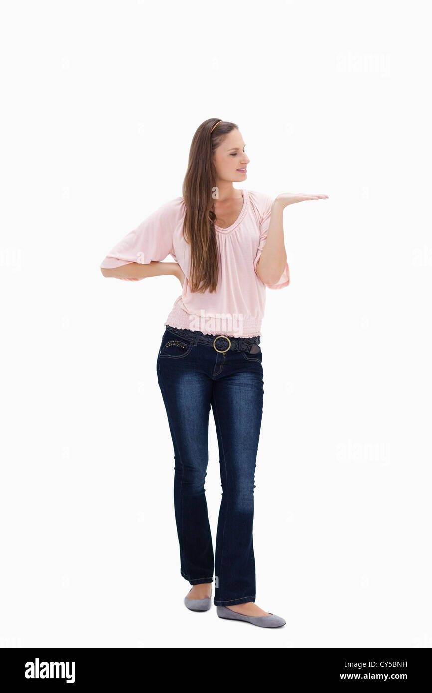 Young woman holding her hand out Stock Photo - Alamy