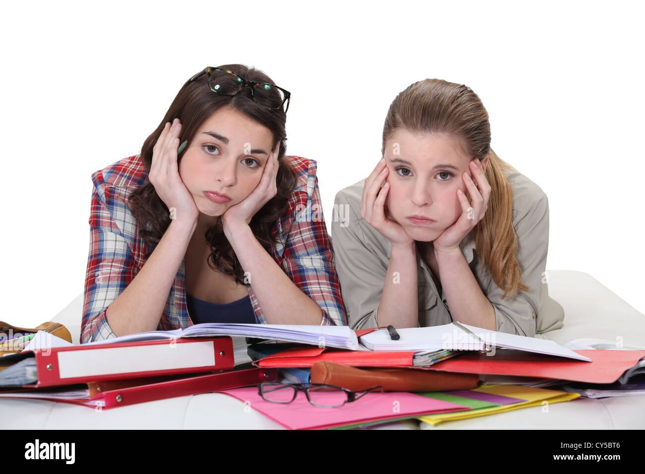 Young women sick of studying Stock Photo - Alamy