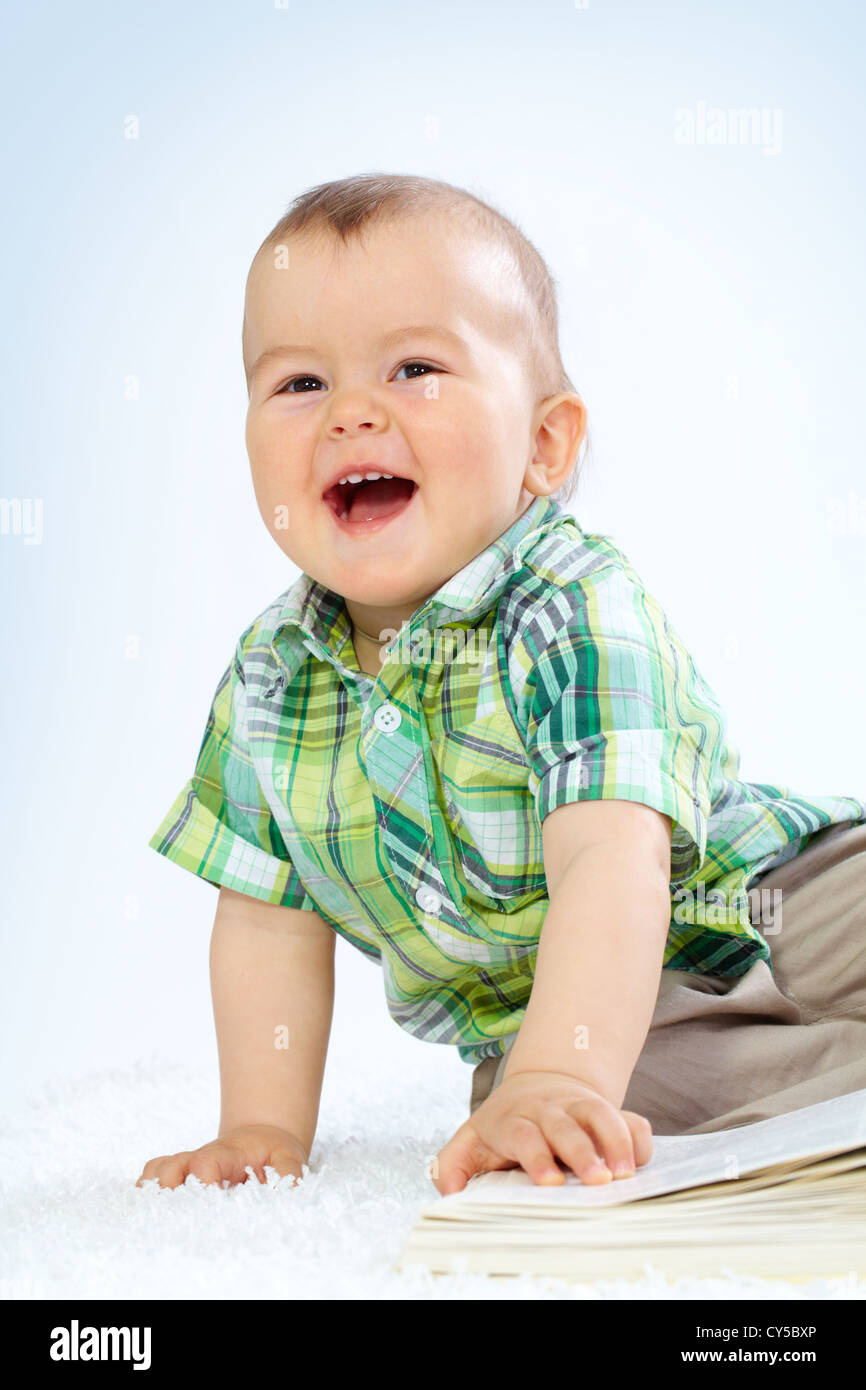 Portrait of happy boy with open book over white background Stock Photo ...