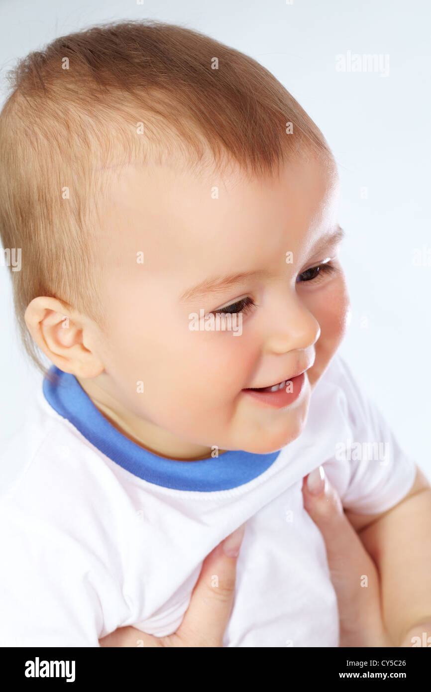 Portrait of happy boy laughing on white background Stock Photo - Alamy