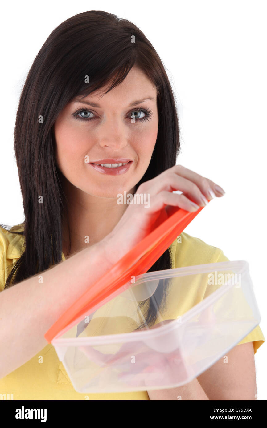 Woman opening food storage box Stock Photo - Alamy