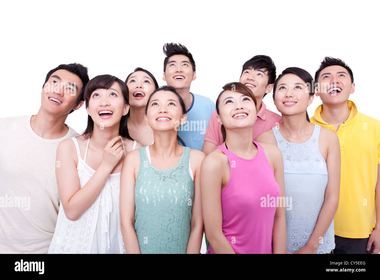 Happy young friends looking up Stock Photo - Alamy