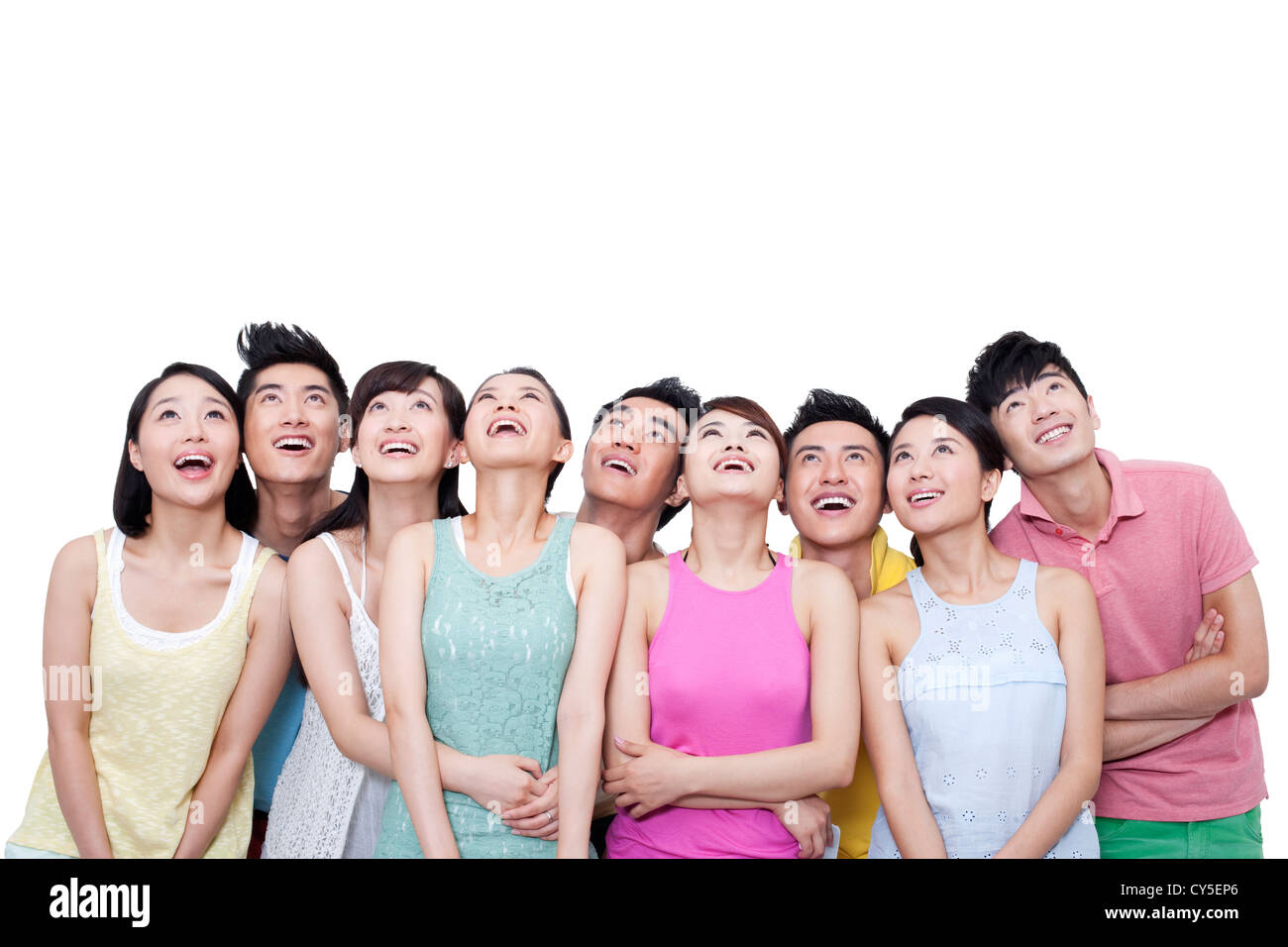 Standing looking away arms crossed in a row hi-res stock photography ...