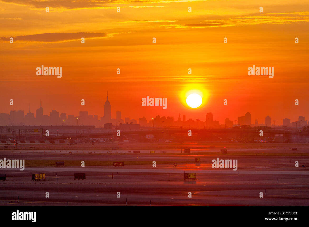 Sunrise over New York City and an airport Stock Photo - Alamy