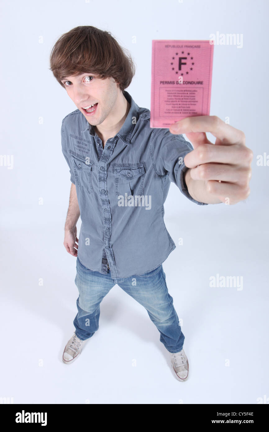 Teenage boy with driving license Stock Photo - Alamy