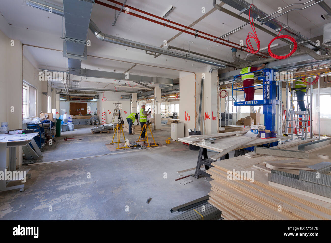 Construction Workers Working Inside