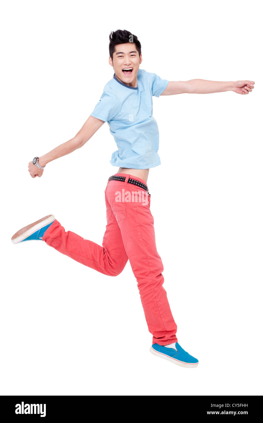 Happy young man jumping Stock Photo - Alamy