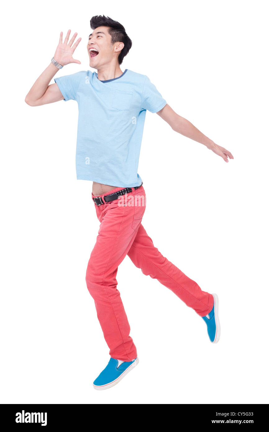 Happy young man jumping Stock Photo - Alamy