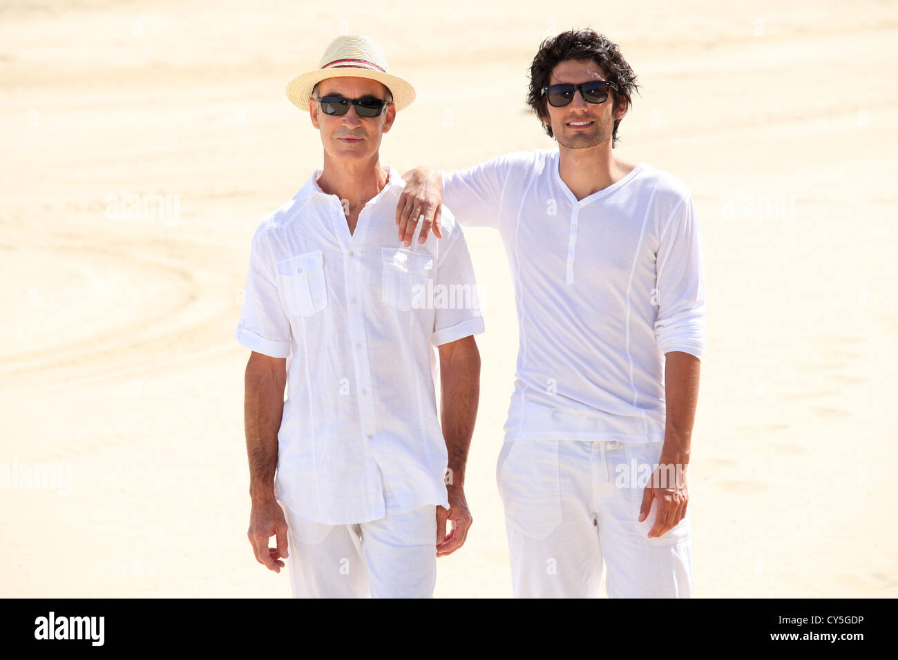 Father and son stood on beach Stock Photo - Alamy