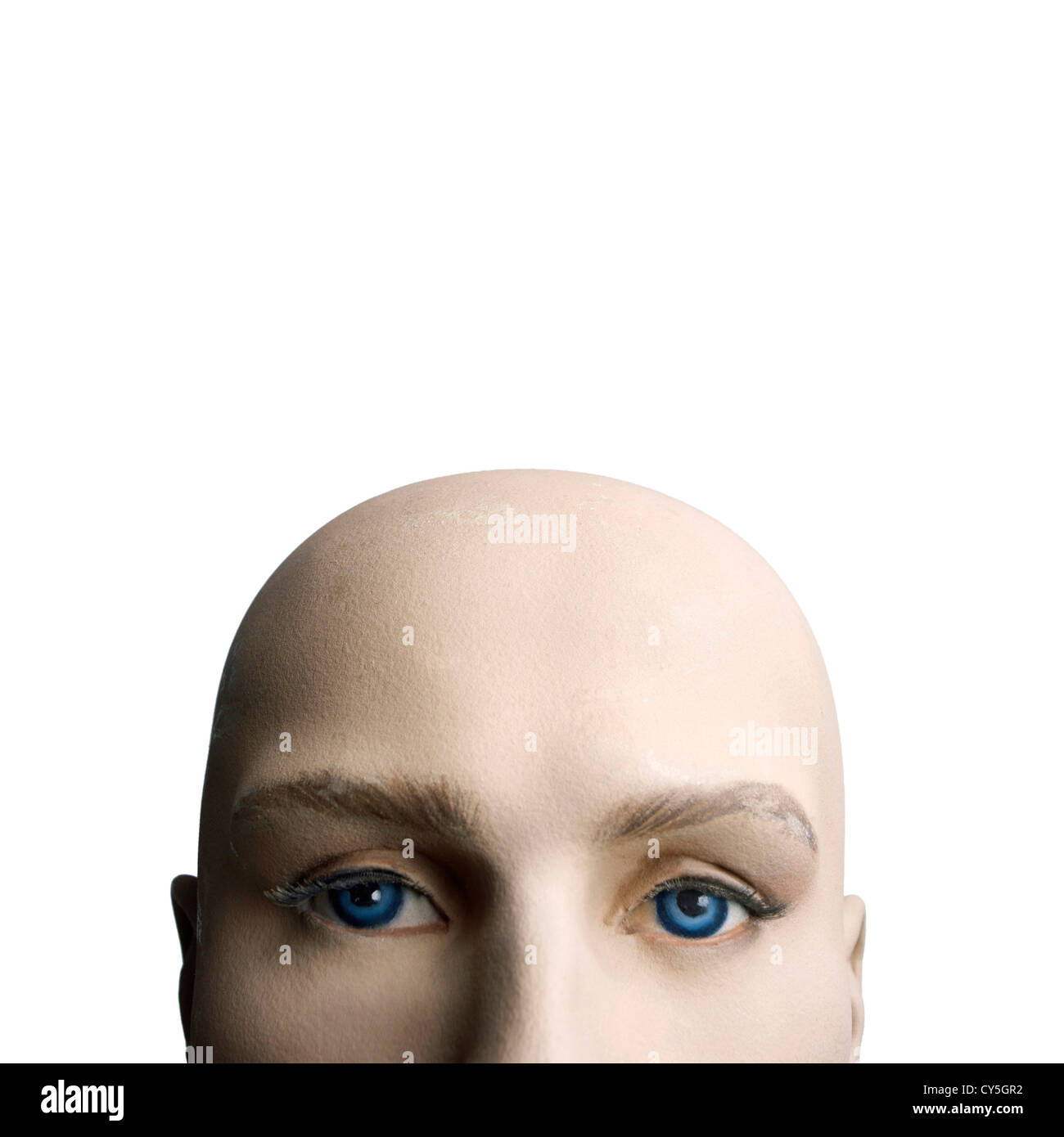 Dummy head sculpture with striking blue eyes against white background ...