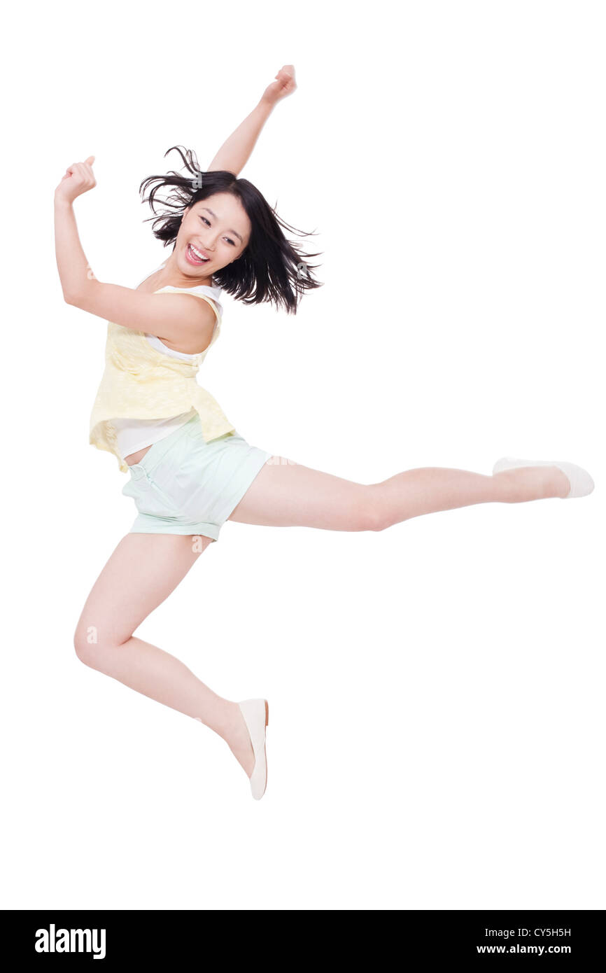 Happy young woman jumping Stock Photo - Alamy