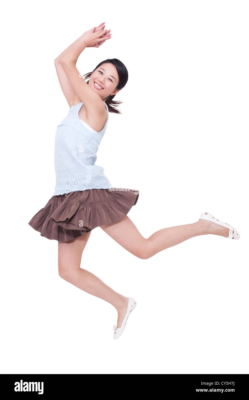 Happy young woman jumping Stock Photo - Alamy