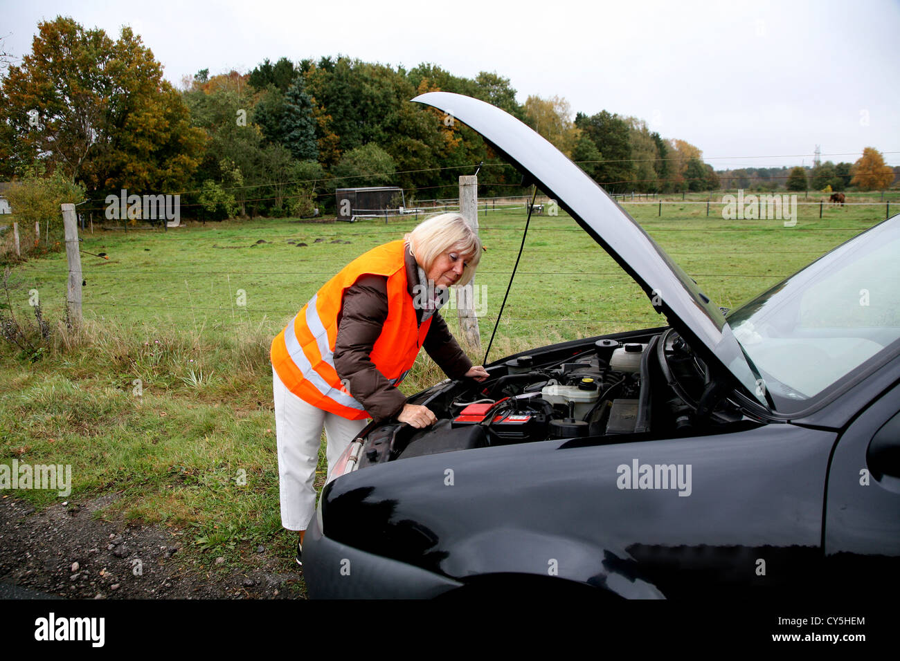 Senior woman driving highway hi-res stock photography and images - Alamy