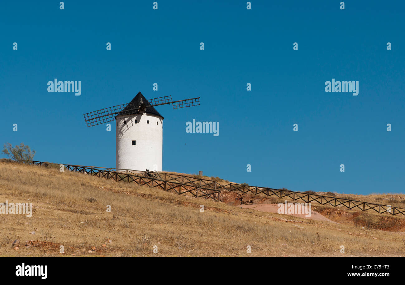 White ancient windmill. Blue sky background Stock Photo - Alamy